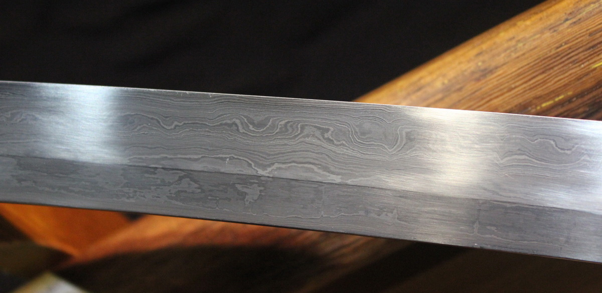 Why the japanese sword is folded during production